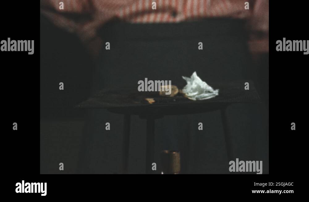 1950s: paper on grid above bunsen burner. Objects catch fire above ...