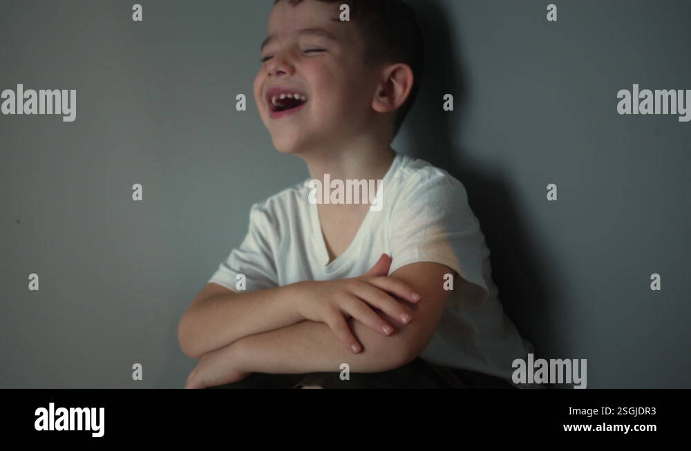 Sad upset boy sitting in corner lifestyle. Child abuse. Portrait of a ...