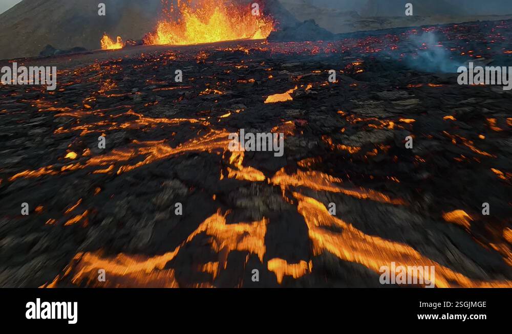 Flying low through an exploding Volcano magma cone - dramatic FPV drone ...