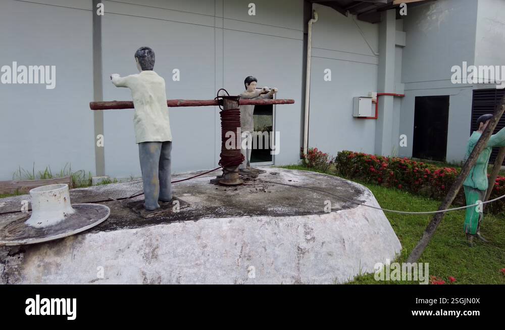 Panning statue of Chinese work at mining site Stock Video Footage - Alamy