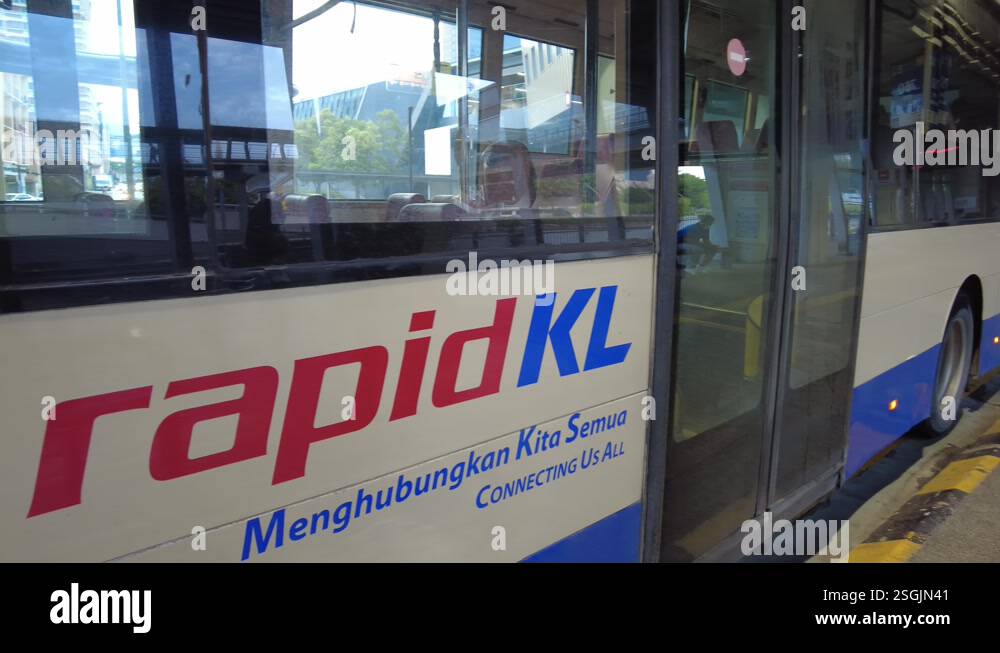 Panning right Rapid KL bus at bus station Stock Video Footage - Alamy