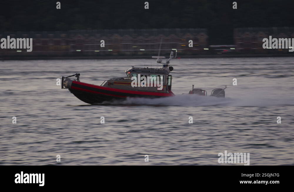 FDNY Speedboat Racing Across The Hudson River Past Large White Cruise ...