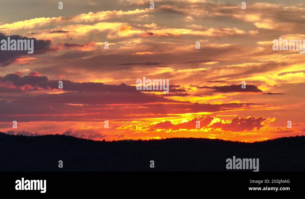 Spectacular golden hour sunset illuminate the sky above lake Stock ...