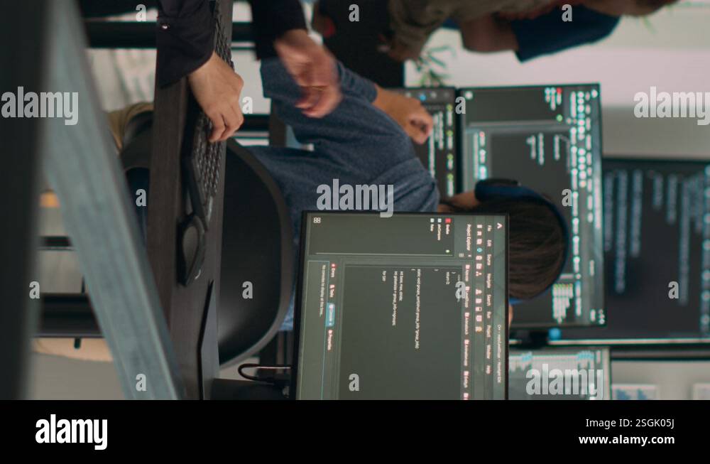 Vertical video: Asian system engineer trying to find html script and ...