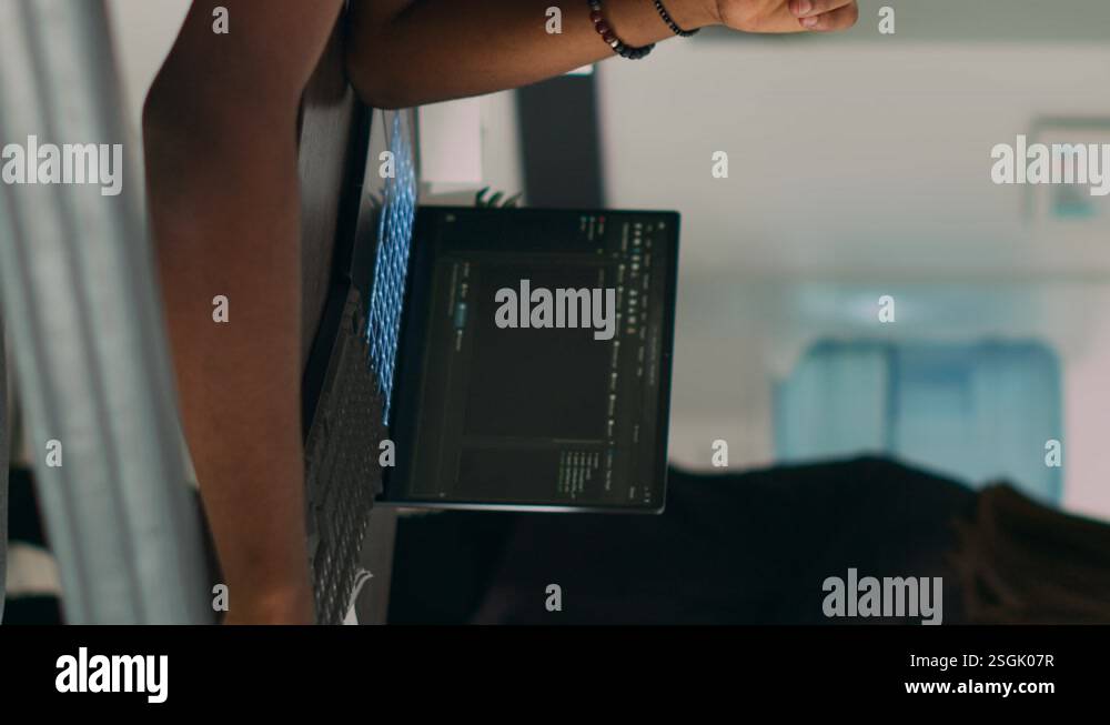 Vertical video: Software developer brainstorming ideas to write code and create Stock Video ...