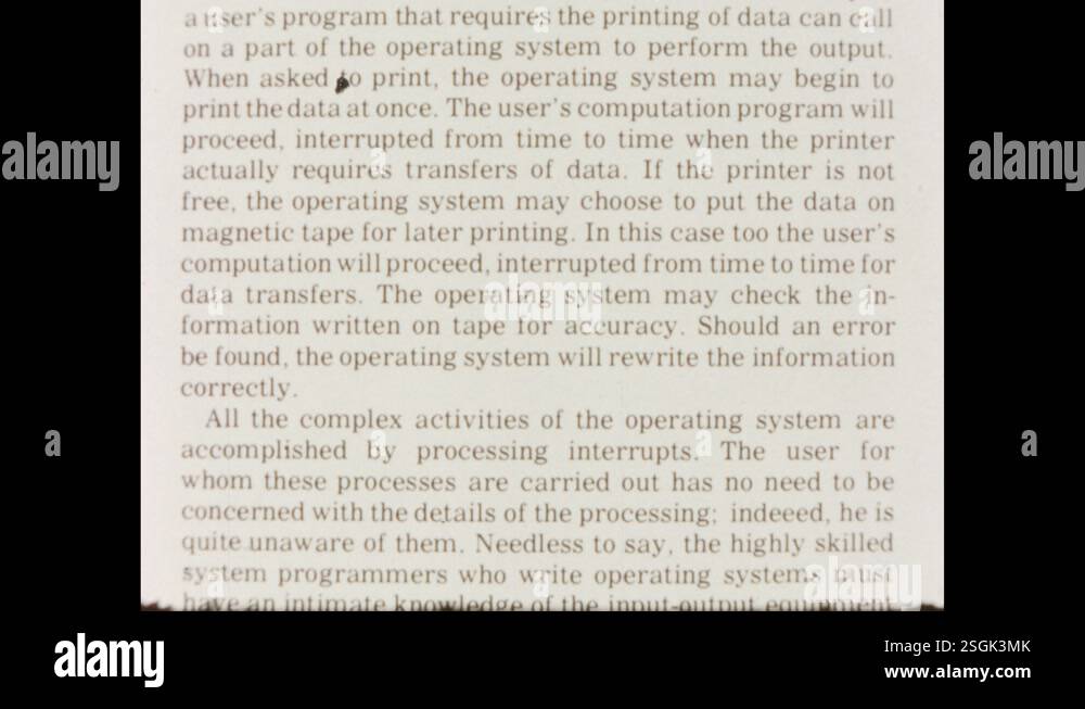 1960s: Examples of fonts. Man feeds tape into phototypesetting machine ...