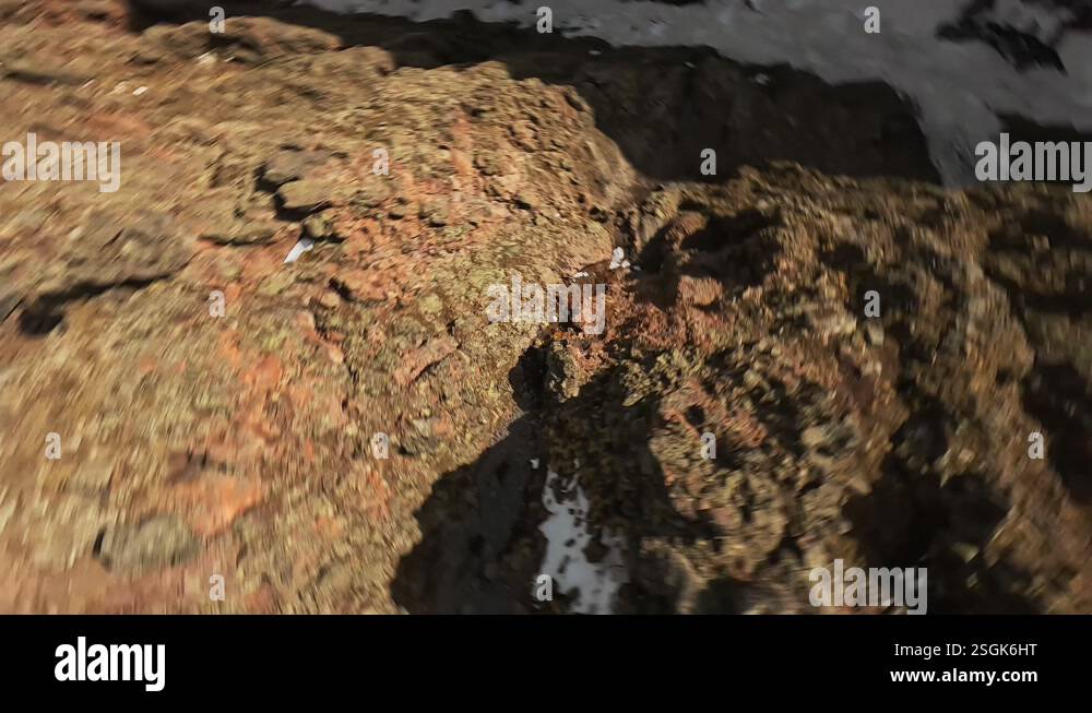 Aerial panorama top view speed dive from cliff mountain stone texture ...