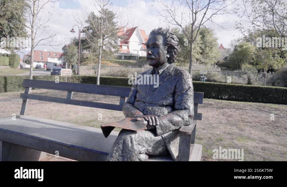 Statue Of Albert Einstein Sitting On A Park Bench In De Haan, Belgium ...