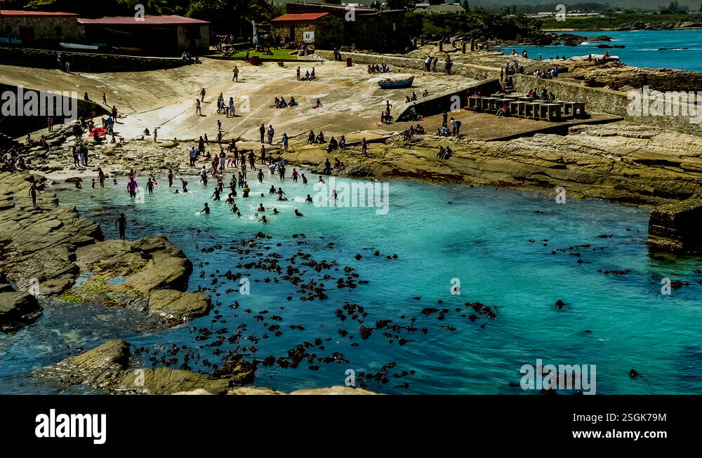 Time lapse of kids swimming in clear blue ocean - Hermanus historic Old ...