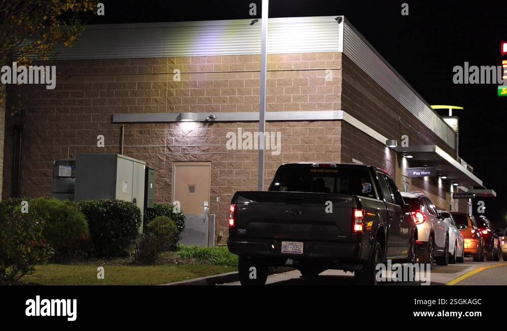 McDonald's fast food at night line of cars in the drive thru Stock ...