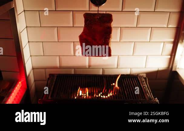 Cooking lard with spices over an open fire, enhancing flavor and aroma ...