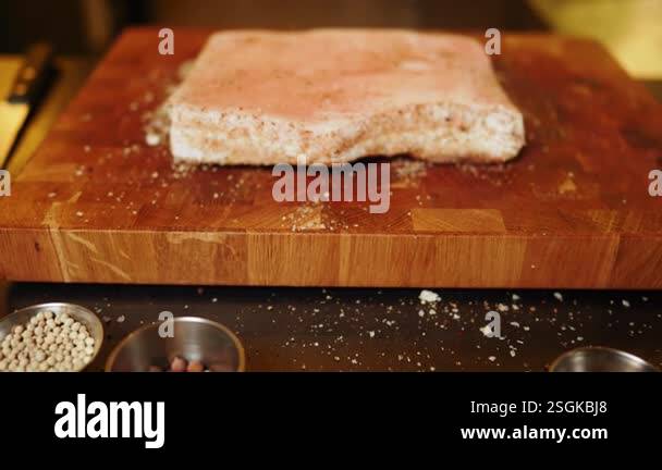 Cooking lard with spices over an open fire, enhancing flavor and aroma ...