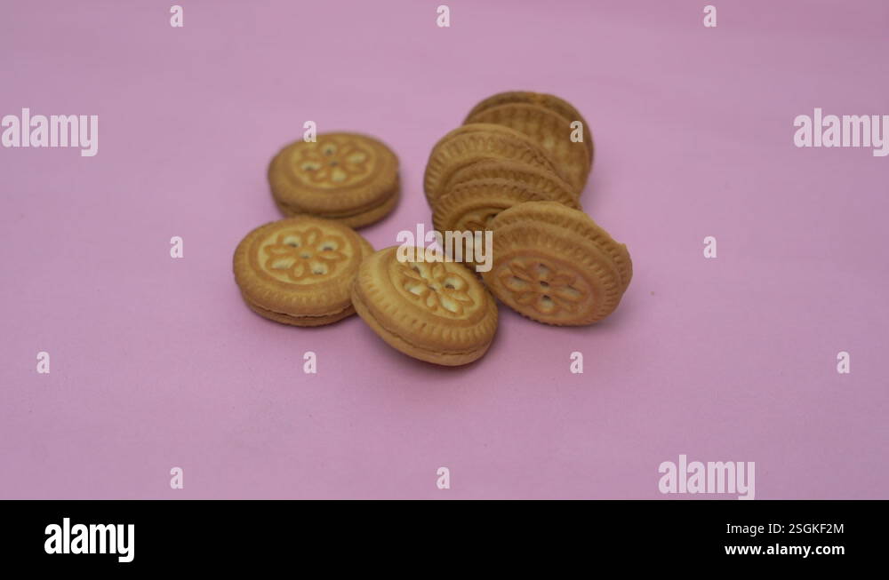 pink background rolling biscuits wide view Stock Video Footage - Alamy