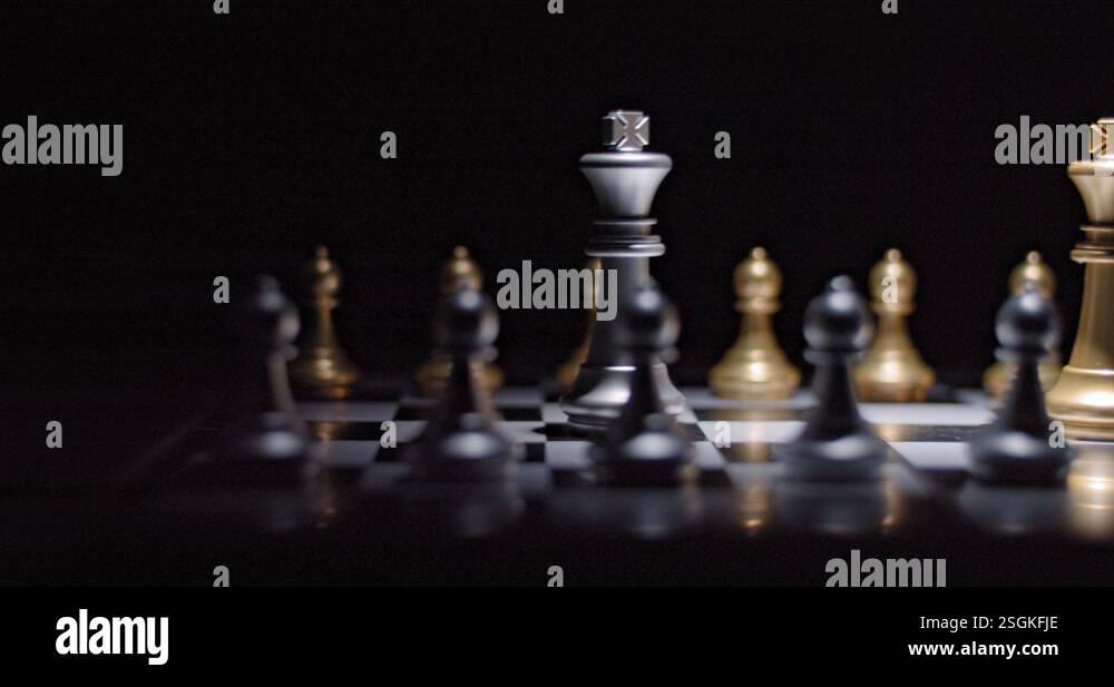 Dramatic lighting on chess board - two kings facing off, trucking right ...