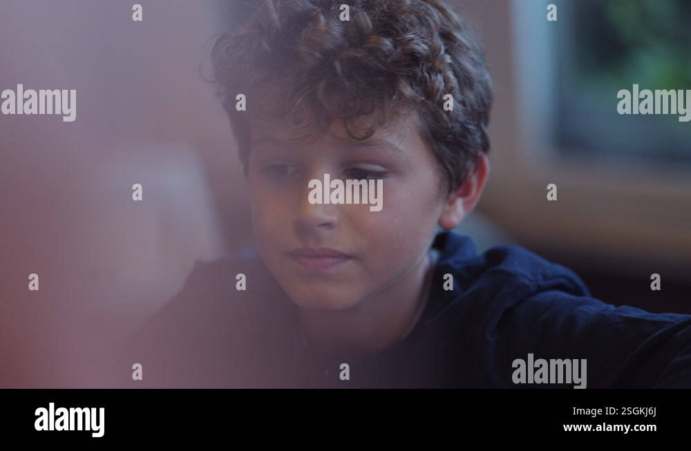 Pensive young boy portrait contemplative child face closeup Stock Video Footage - Alamy