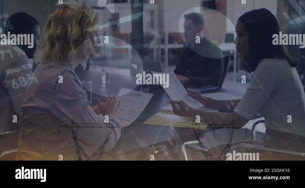 Statistical Data Processing Against Two Diverse Female Office Colleagues Stock Video Footage Alamy