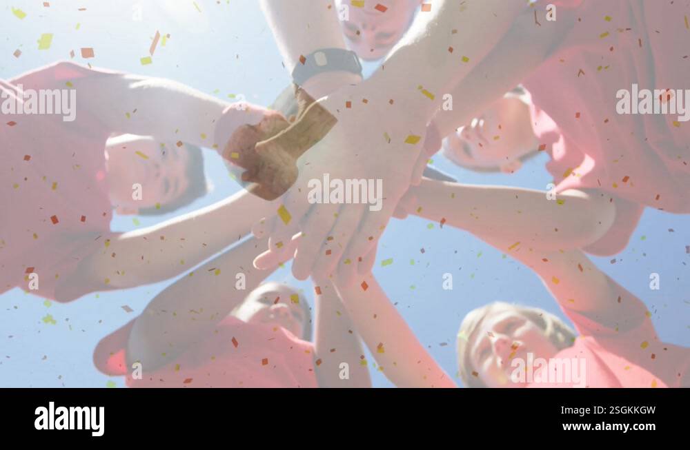 Animation of confetti falling over team of diverse children clapping ...
