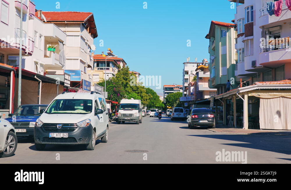 video of a normal street in Turkey full of cars and shops, taken from a ...