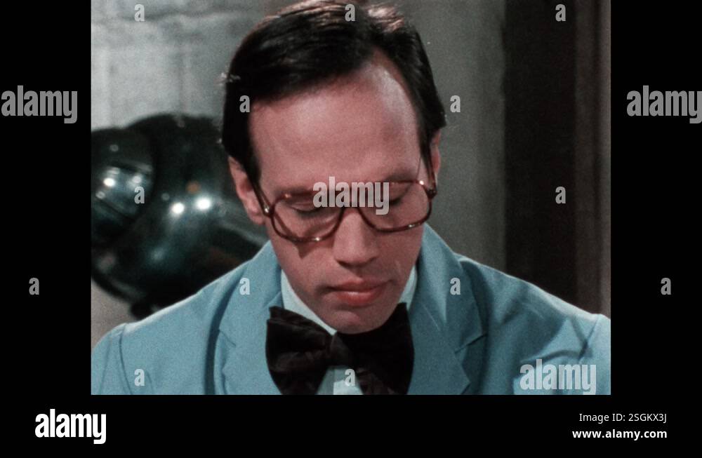 1980s:Hand opens switch on electrical pathway. Wires place on switch ...