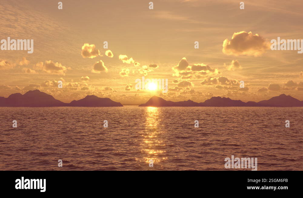 Sun rising behind mountains and clouds with camera moving over the ...