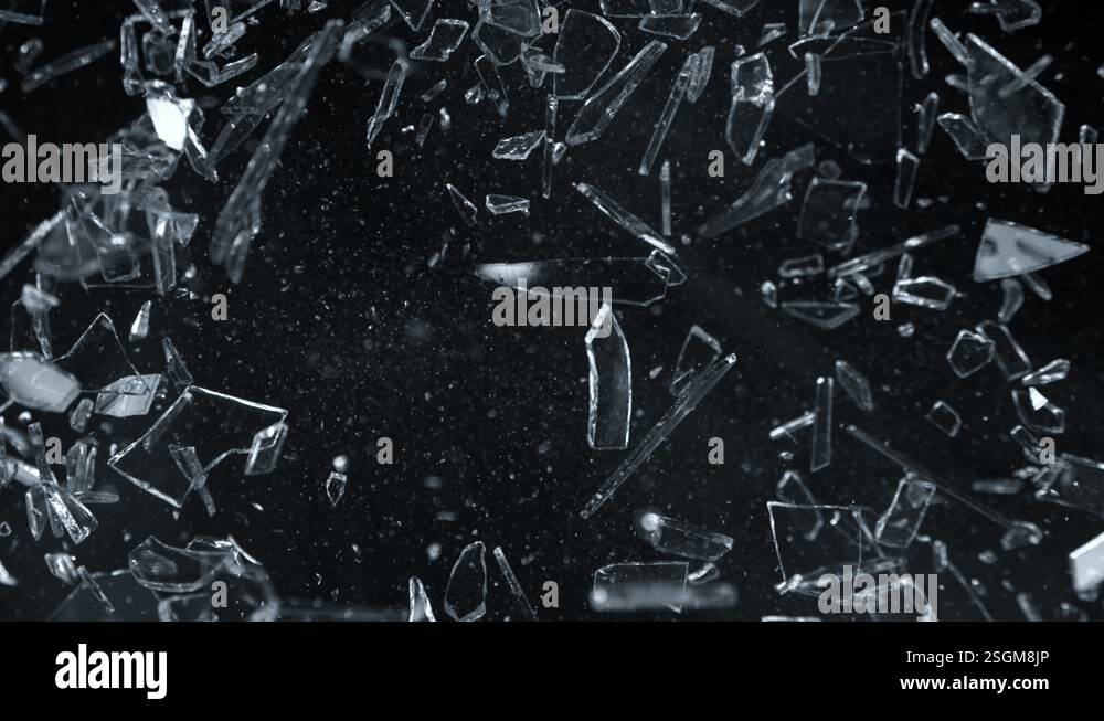 Super Slow Motion Shot of Glass Shards Flying Towards Camera Isolated ...