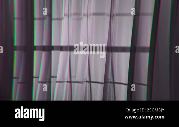 Windows with colorful tulle fabrics blown by the wind. Transparent silk ...