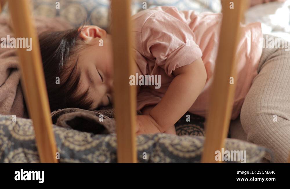 Sweet nap of baby girl with pink shirt in her crib Stock Video Footage ...
