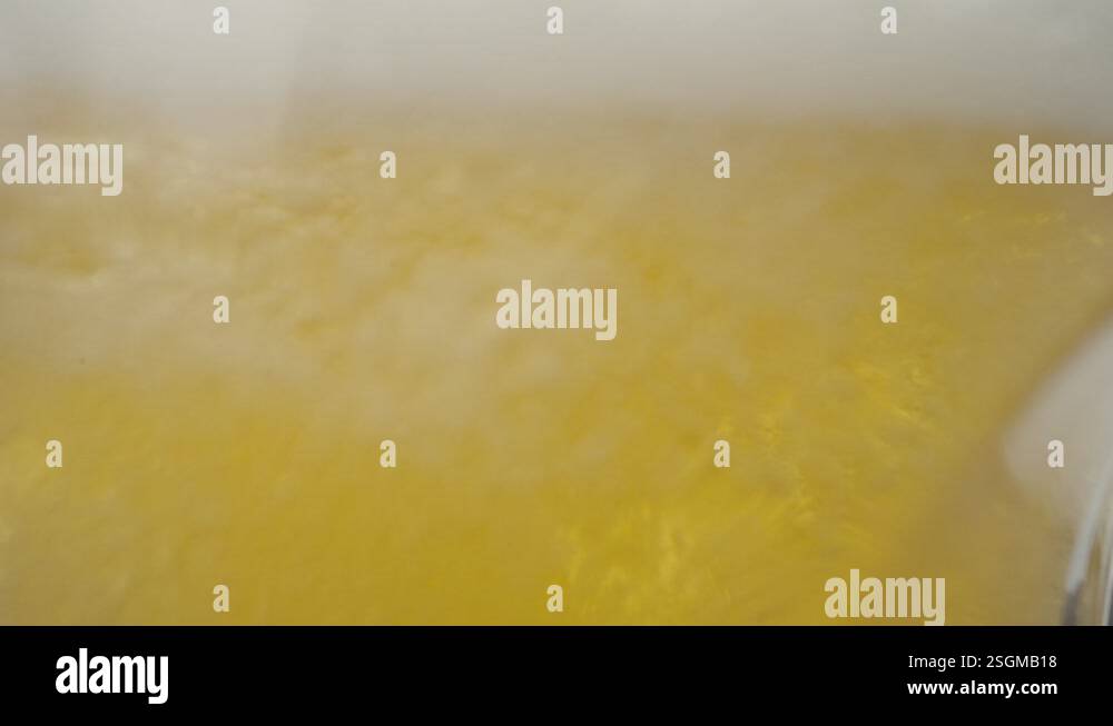 a glass being filled with beer and it's fuzz Stock Video Footage - Alamy