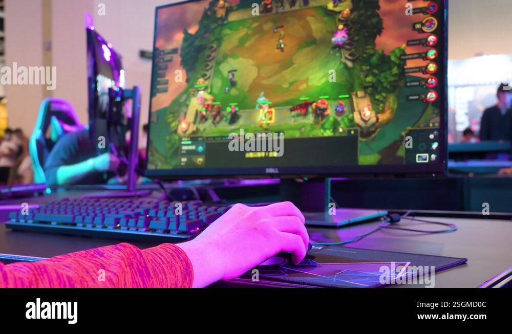 A Chinese visitor seen playing an online PC computer video game as ...