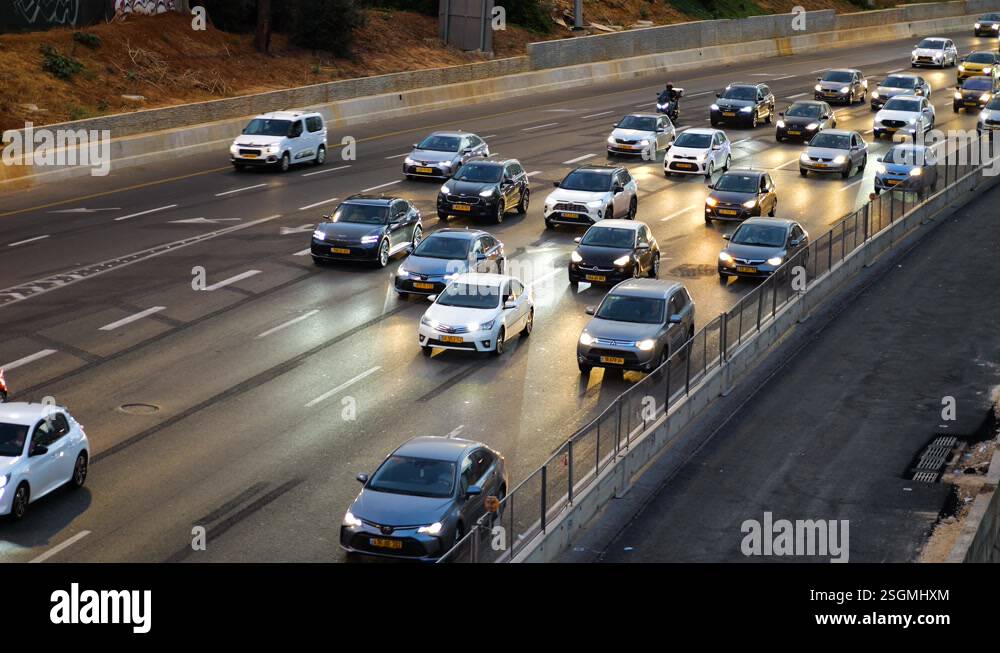 Busy multi lane highway with cars in slow moving lines, front view ...