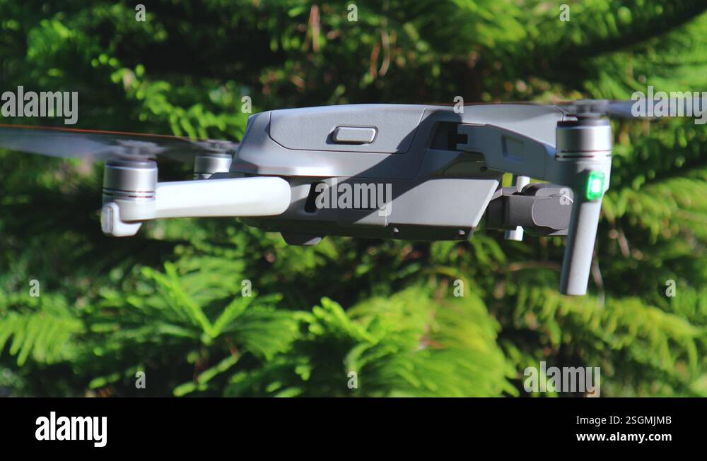 Drone quadcopter flying and turning around, spying, surveillance and ...