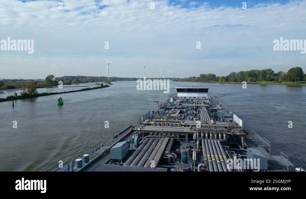 Flying Over Tanker Ship Navigating On A River In Barendrecht ...