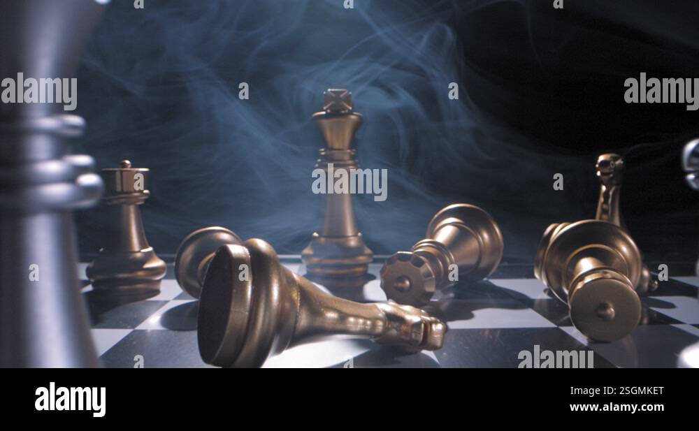 Smoky sliding shot of the lone king on a chessboard surrounding by ...