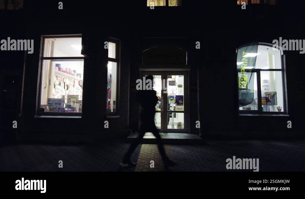 Blackout in Kyiv. A working store with lights off exterior signage in ...