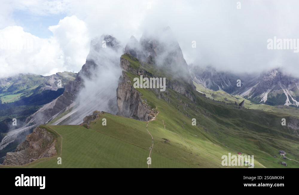Stunning drone shot showing path on mountain summit and rocky steep ...
