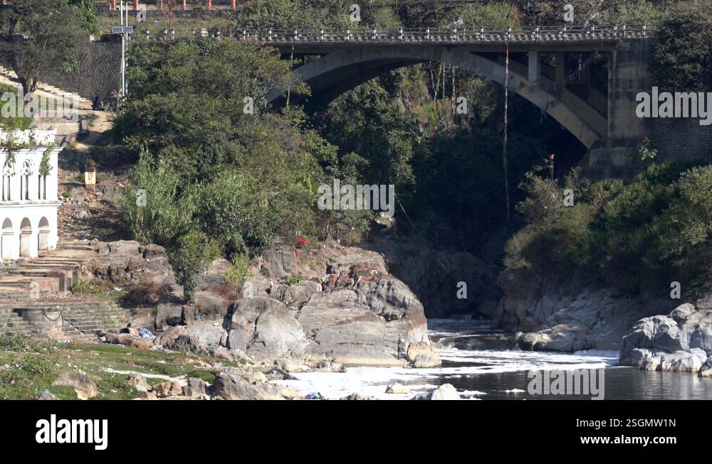 A bridge spanning the Bagmati River as it comes out of the Kathmandu ...