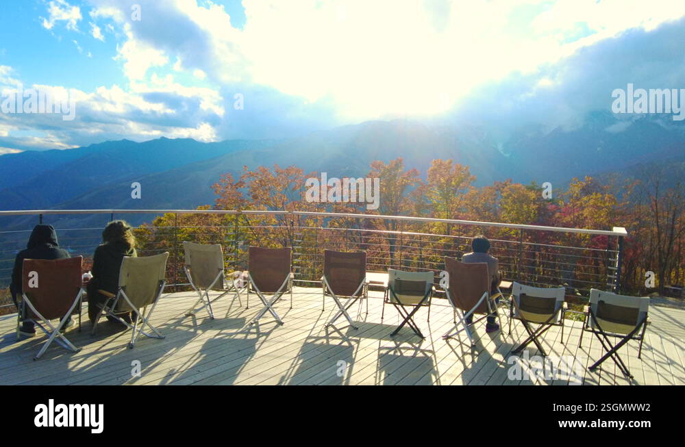 People relaxing at the terrace on peak of Mt. Hakuba in Nagano, Japan ...