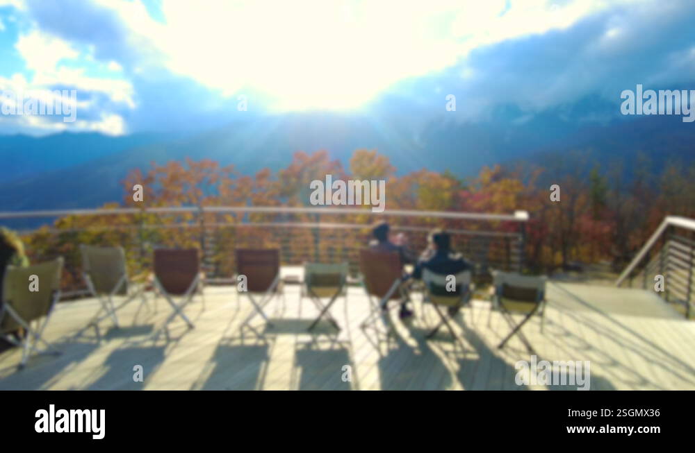 Blurred shot of people relaxing at terrace on Mt. Hakuba in Nagano ...