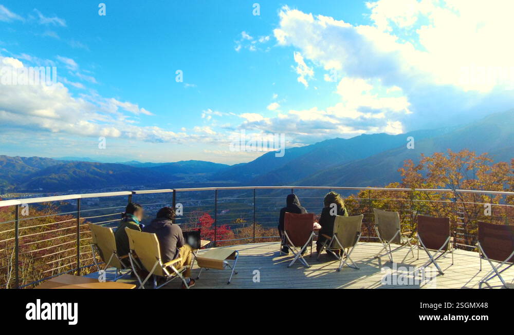 People relaxing at terrace on Mt. Hakuba in Nagano, Japan. 4K Stock ...