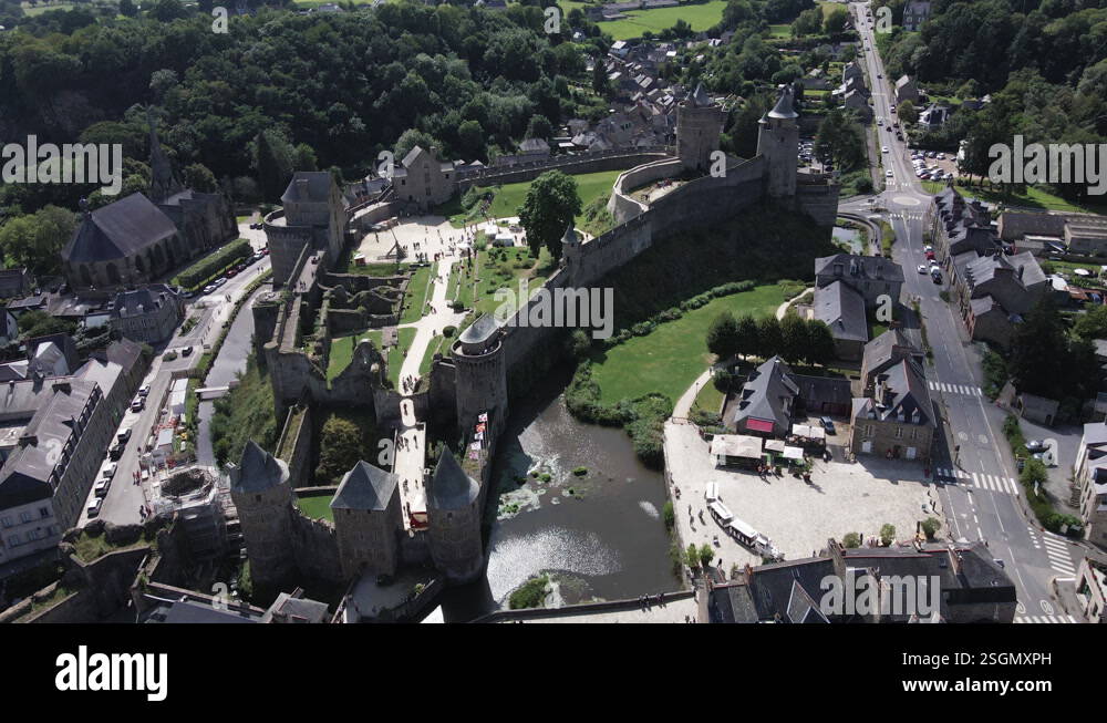 Aerial top-down forward over ramparts and moat of Fougères castle Stock ...