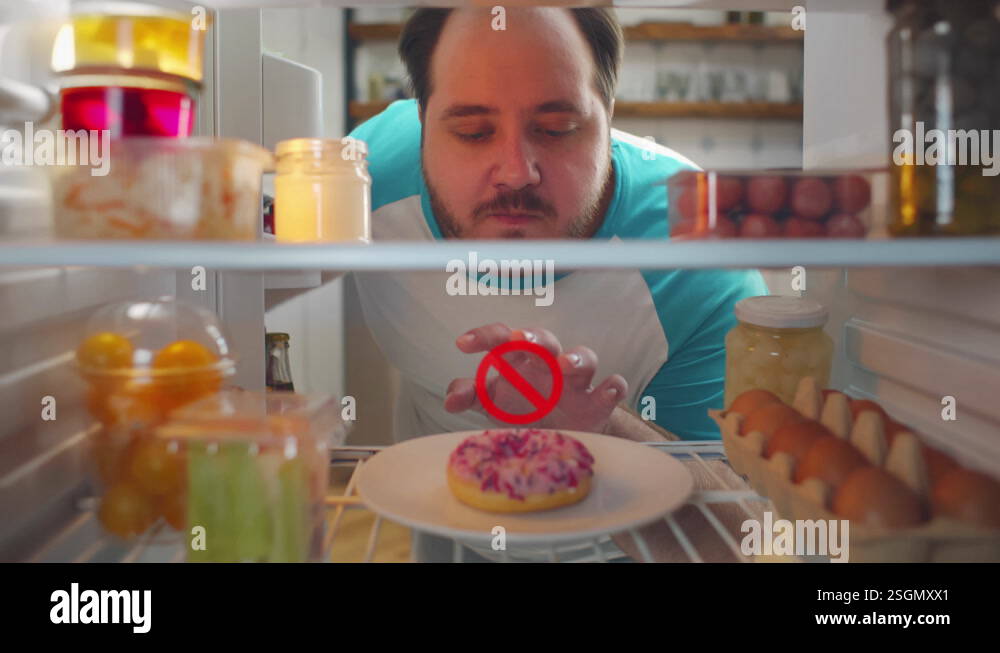 Fat man open fridge and look at donut with restriction hologram over it ...