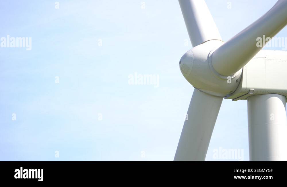 Huge Wind Turbine Blade Rotating against a Soft Cloudy Sky Background ...