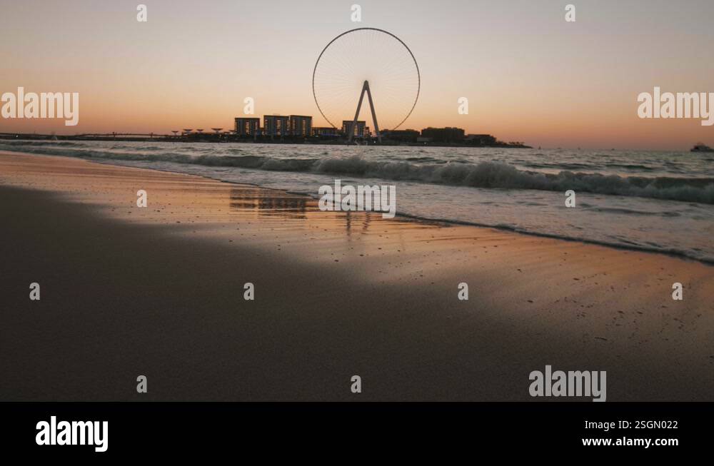 Biggest Ferris Wheel In The World at Sunset, Dubai Beach Waves Stock ...