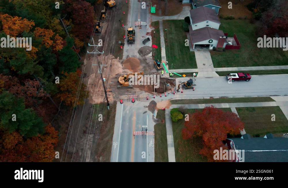 High rotation over a hold in the ground for sewer and water work Stock ...