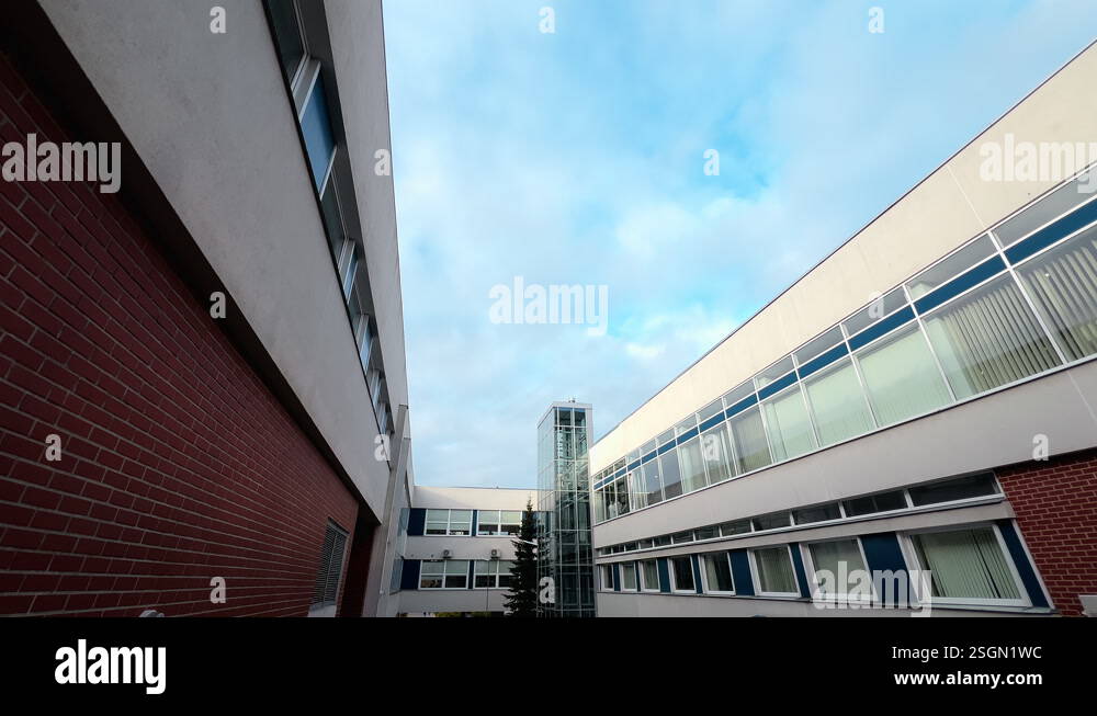 Wide angle: Modern hospital building with glass windows and an elevator ...