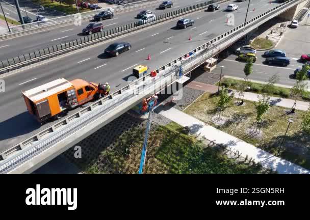 Aerial view of road maintenance with workers and equipment on a highway ...