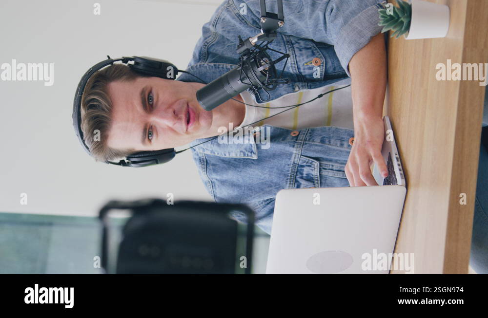 Vertical Video Of Display On Back Of Camera Showing Male Vlogger Live ...