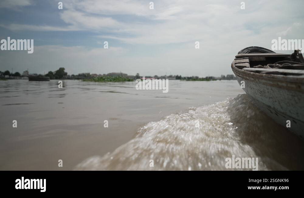 Wooden Boat crossing a River, Economic Challenges and Climate Change in ...