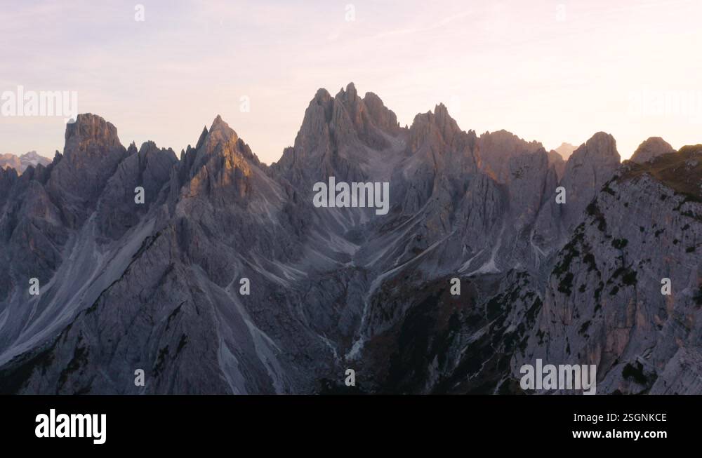 Hikers Enjoy View of Cadini Group during Sunset in the Italian ...
