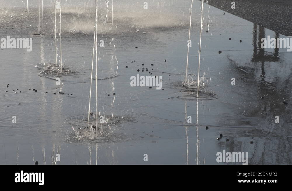Water splashes from a ground fountain in slow motion Stock Video ...